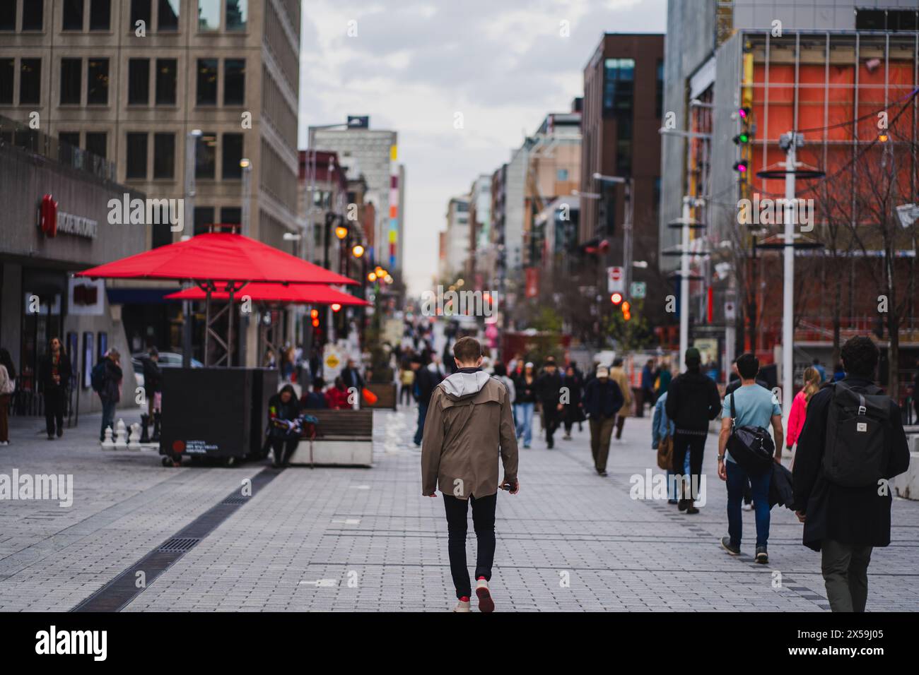 urban scene in place des arts montreal people walking Stock Photo - Alamy