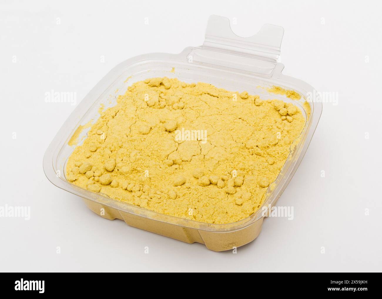 Plastic container of mustard powder Stock Photo - Alamy