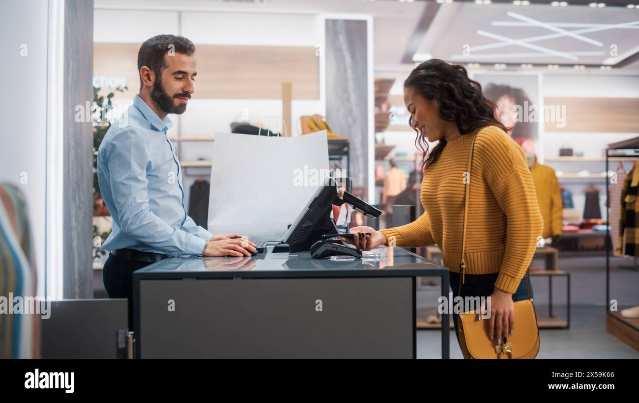 Woman shop sales counter clothes hi-res stock photography and images ...