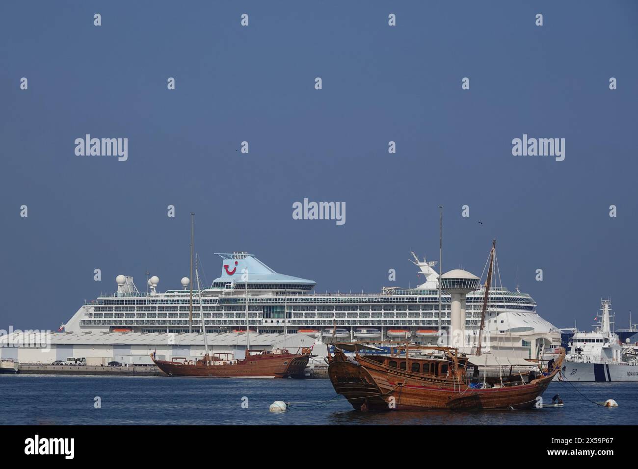 The cruise ship Marella Discovery 2 and a traditional wooden dhow in ...