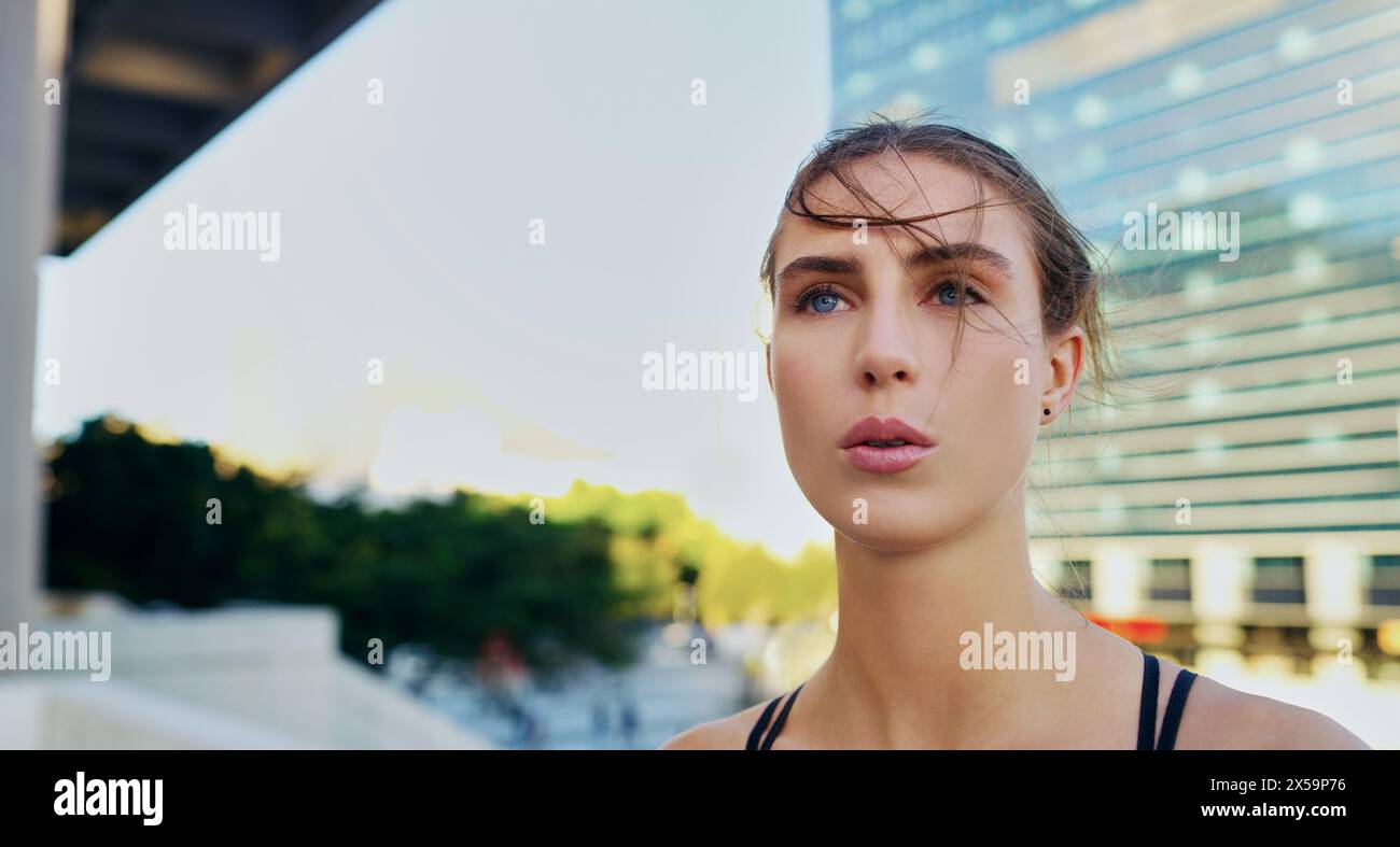 Woman, workout and tired in city for running, training and exercise ...