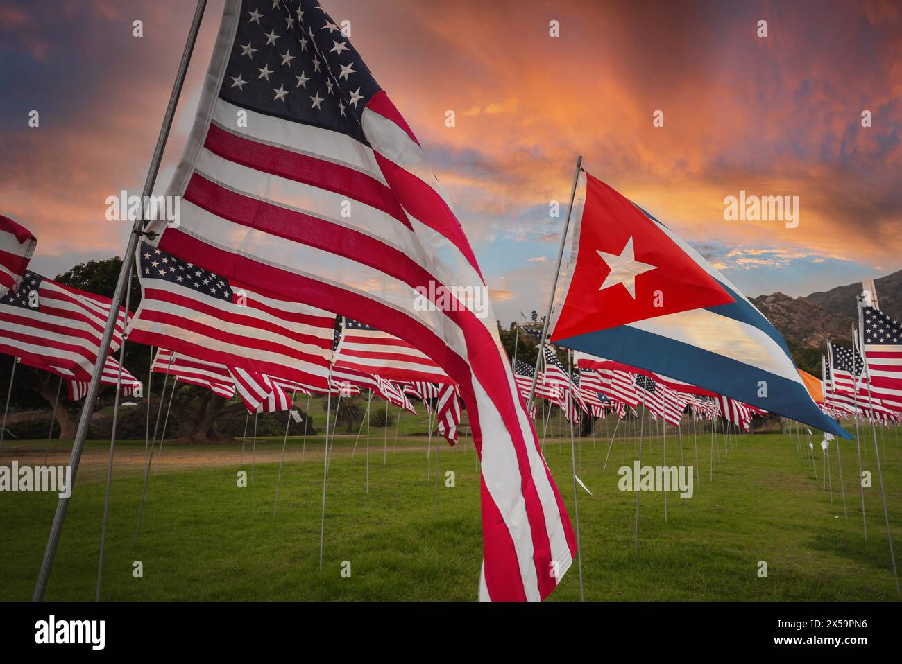 American flags flutter over Californian landscape at sunset Stock Photo ...