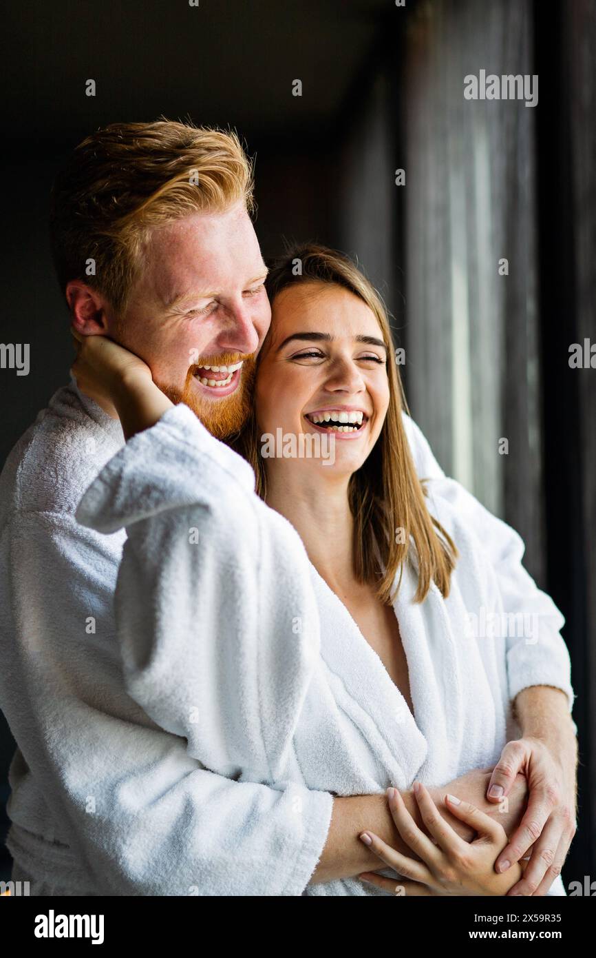 Beautiful young couple enjoying and relaxing in SPA center. People ...