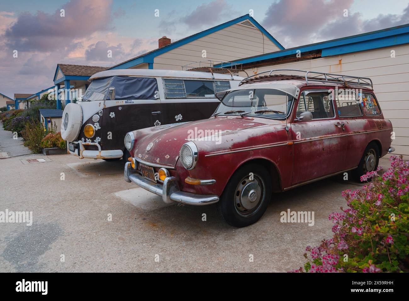 Vintage Volkswagen Bus and Red Station Wagon Parked Near Blue Building ...