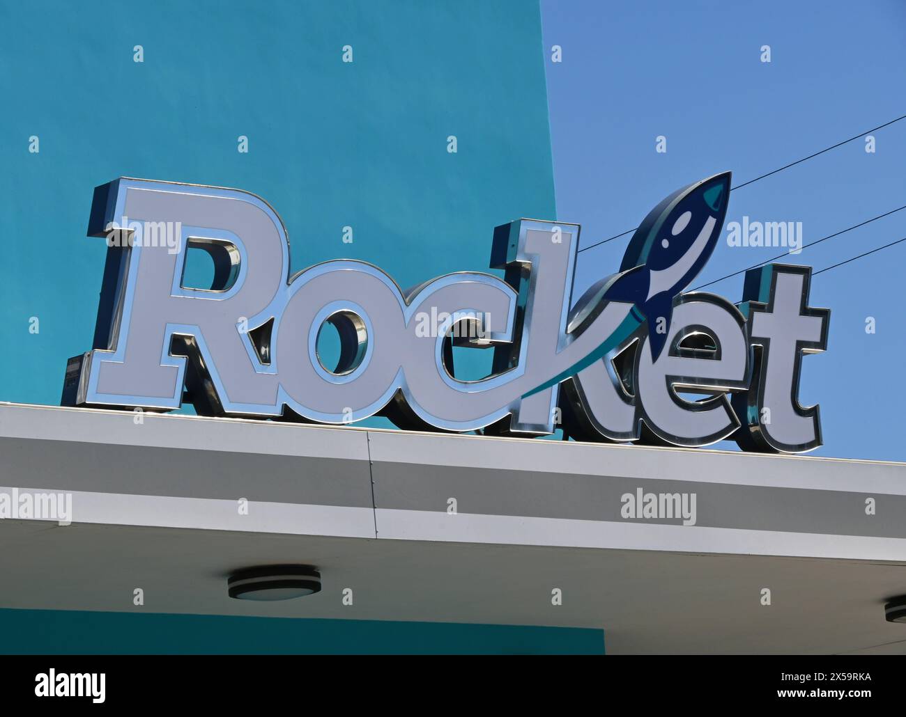 WHITTIER, CALIFORNIA - 28 APR 2024: Rocket Convenience Store sign atop ...