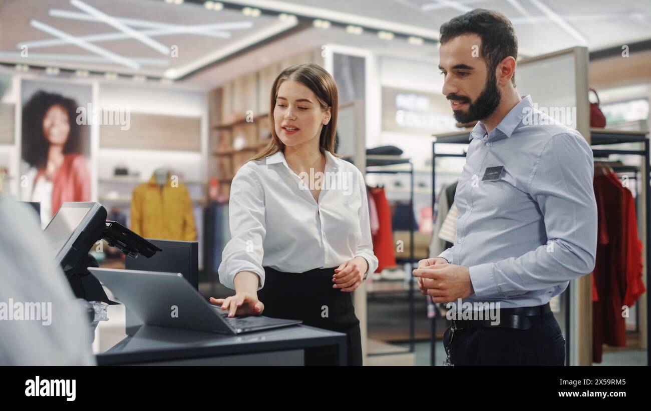 Clothing Store: Businesswoman Uses Laptop Computer, Talks to Visual ...