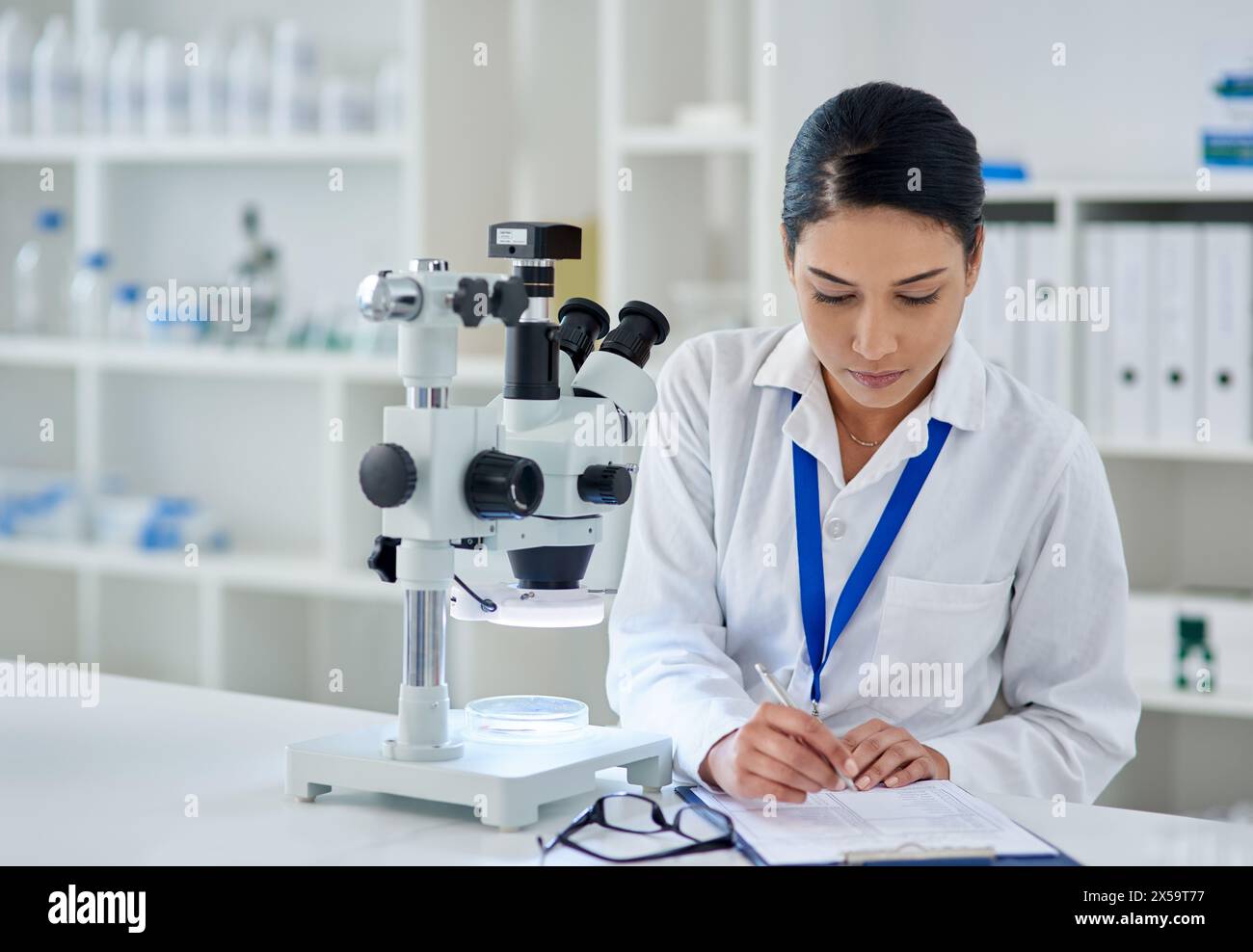 Table worker laboratory microscope documents hi-res stock photography ...