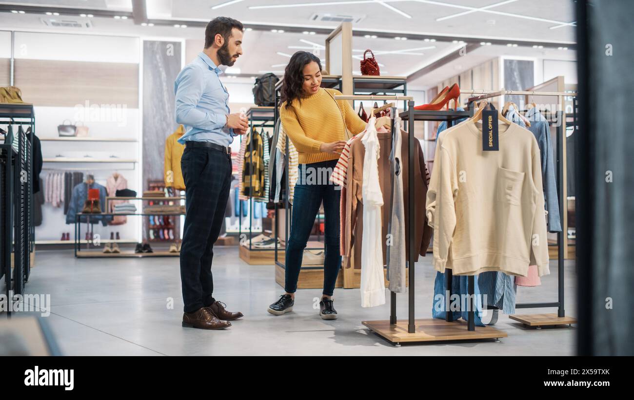 Woman choosing fashionable clothing hi-res stock photography and images ...