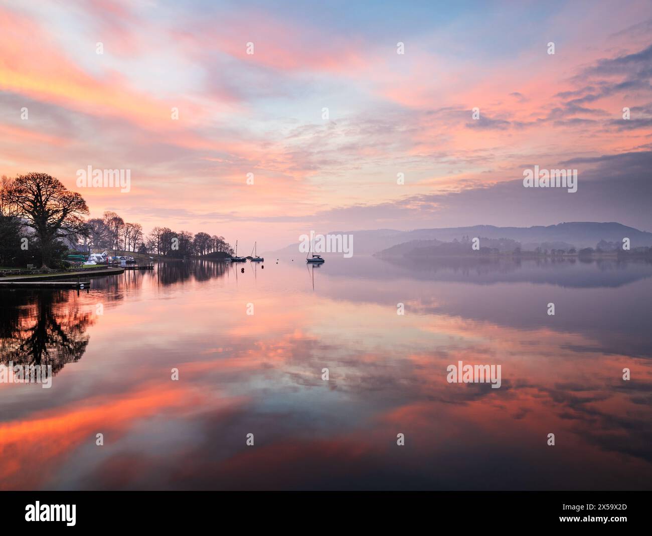 Dawn reflections on Windermere, from Waterhead pier, Cumbria, England ...