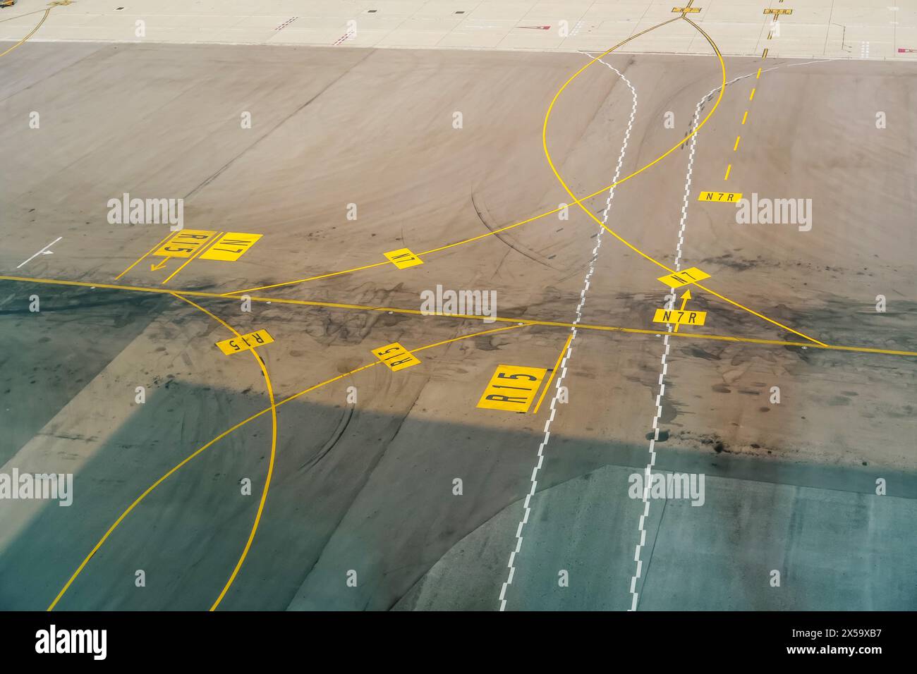 Aerial top view of a commercial airport runway with connections and ...