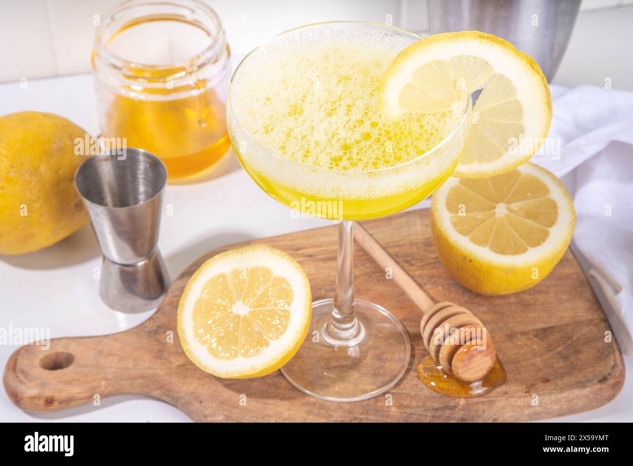 Sweet and sour boozy alcohol bee's knees cocktail. Homemade citrus ...