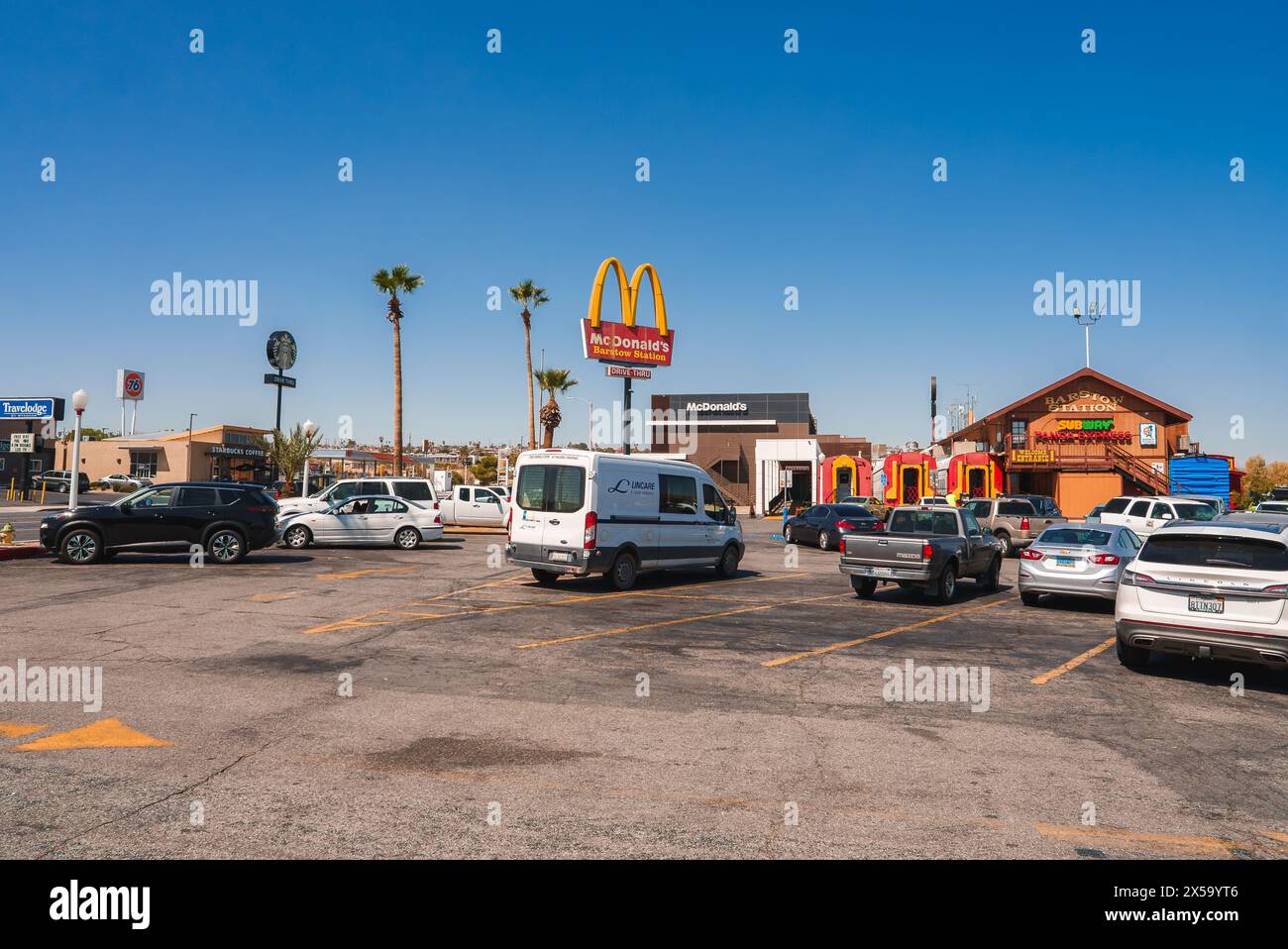 Busy parking lot with McDonald's and palm trees, Barstow, Route 66, USA ...