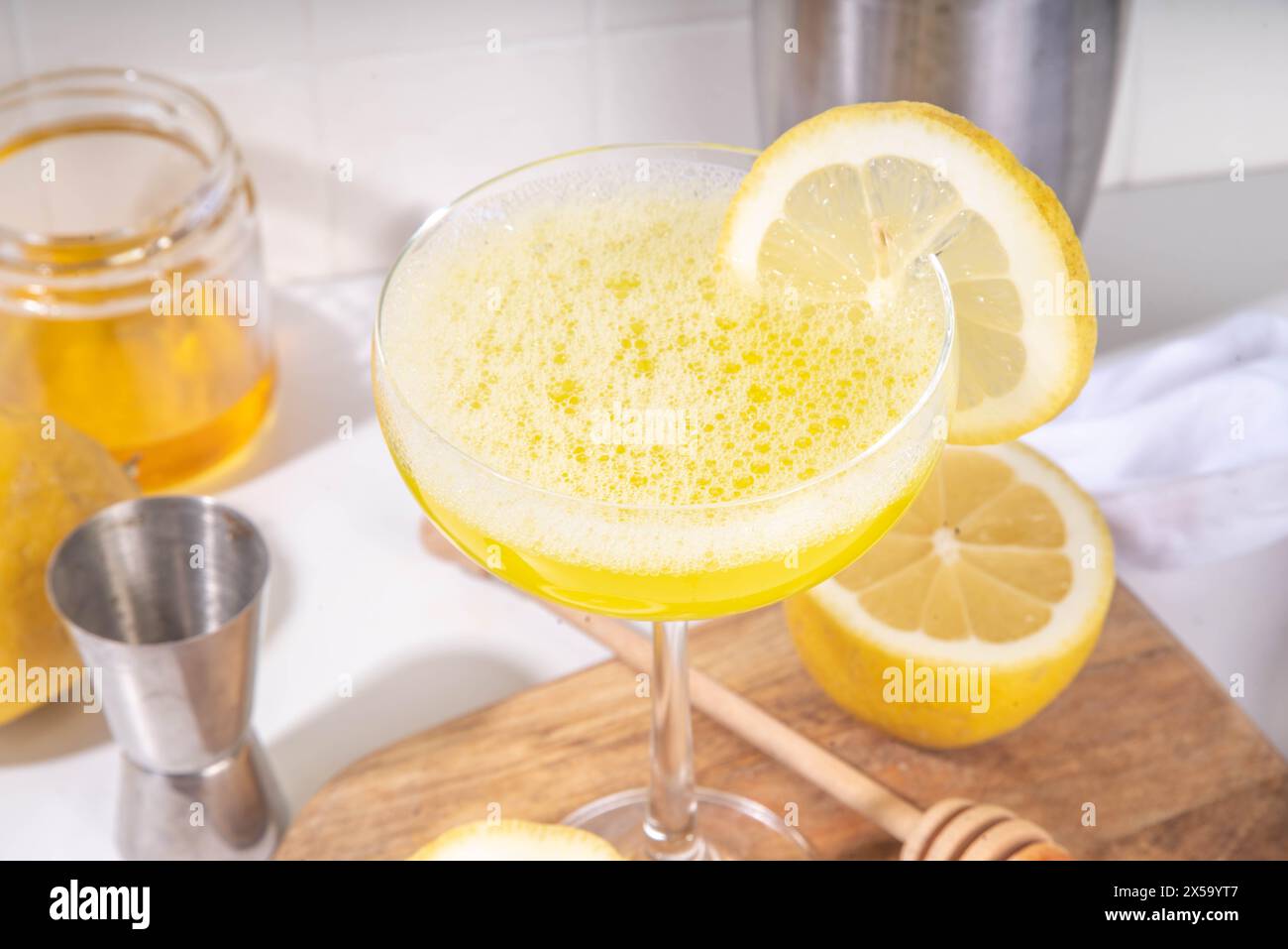 Sweet and sour boozy alcohol bee's knees cocktail. Homemade citrus ...