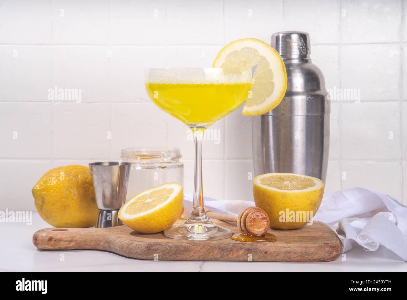 Sweet and sour boozy alcohol bee's knees cocktail. Homemade citrus ...