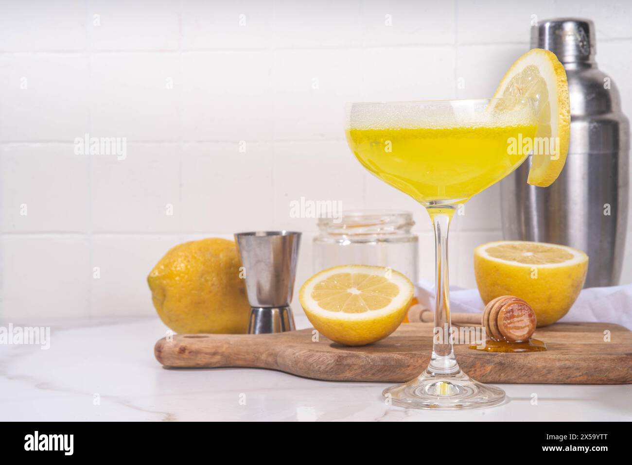 Sweet and sour boozy alcohol bee's knees cocktail. Homemade citrus ...