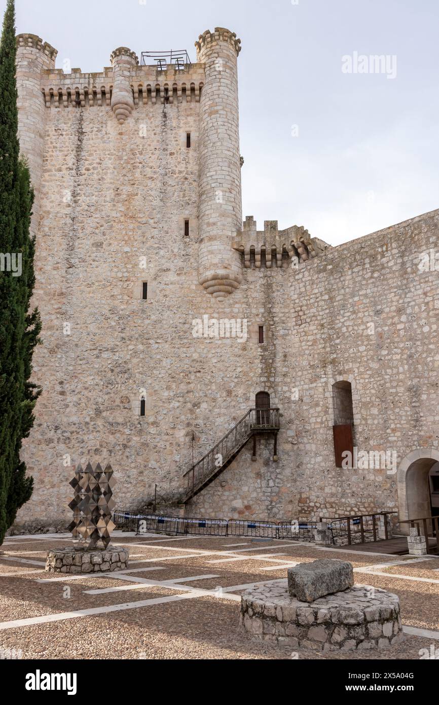 stone castle, tall tower, crenellations, courtyard, clear sky, medieval ...
