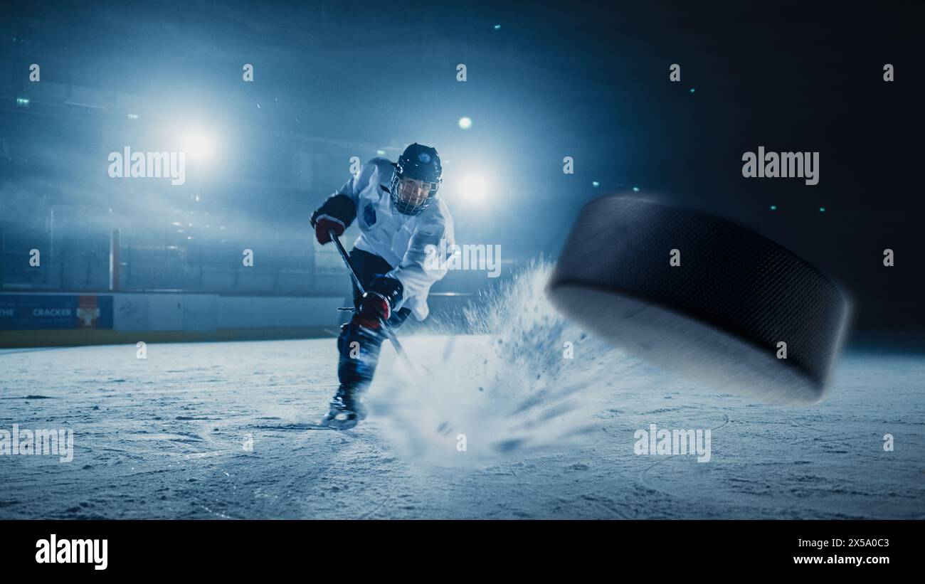 Ice Hockey Rink Arena: Professional Player Shooting the Puck with ...