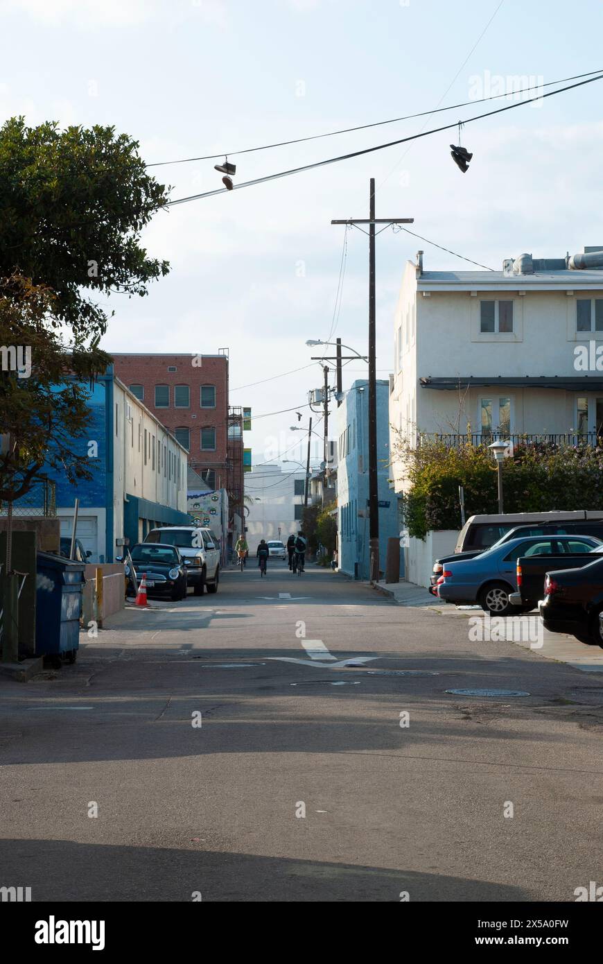 California urban back street with shoes on power line Stock Photo - Alamy