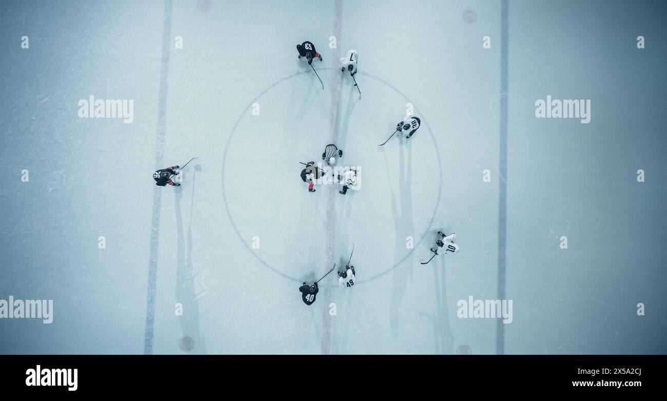 Top View Ice Hockey Rink Arena Game Start: Two Players Face off, Sticks ...