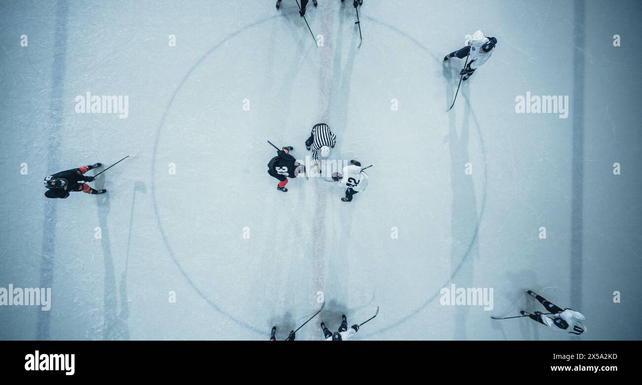 Top View Ice Hockey Rink Arena Game Start: Two Players Face off, Sticks ...