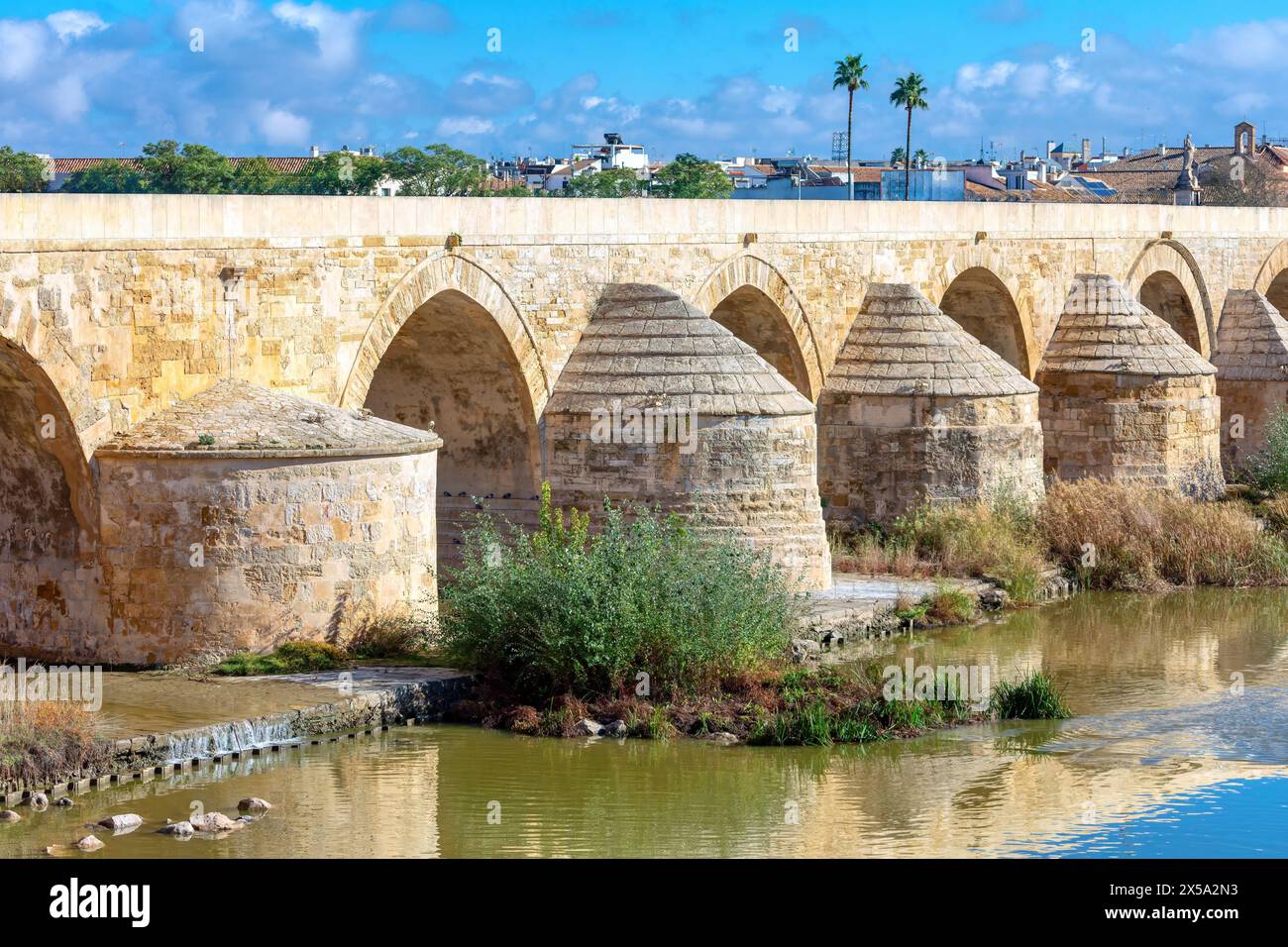 Roman bridge over Guadalquivir river in Cordoba, Spain. Ancient arch ...