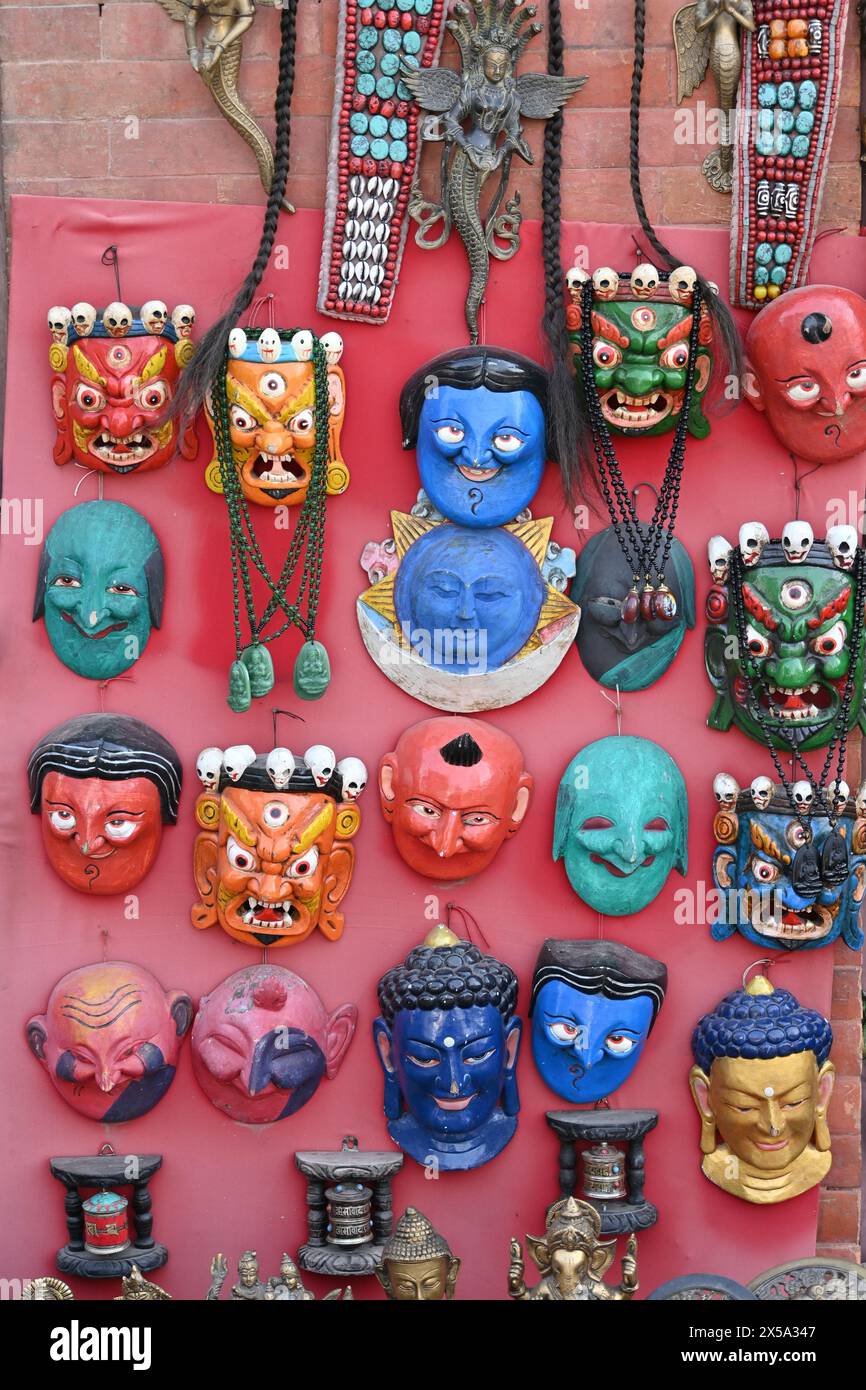 Colorful traditional masks sold in a souvenir shop in Swayambhunath, an ...