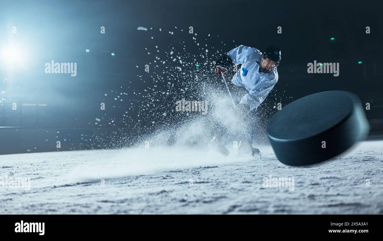 Ice Hockey Rink Arena: Professional Player Shooting the Puck with ...