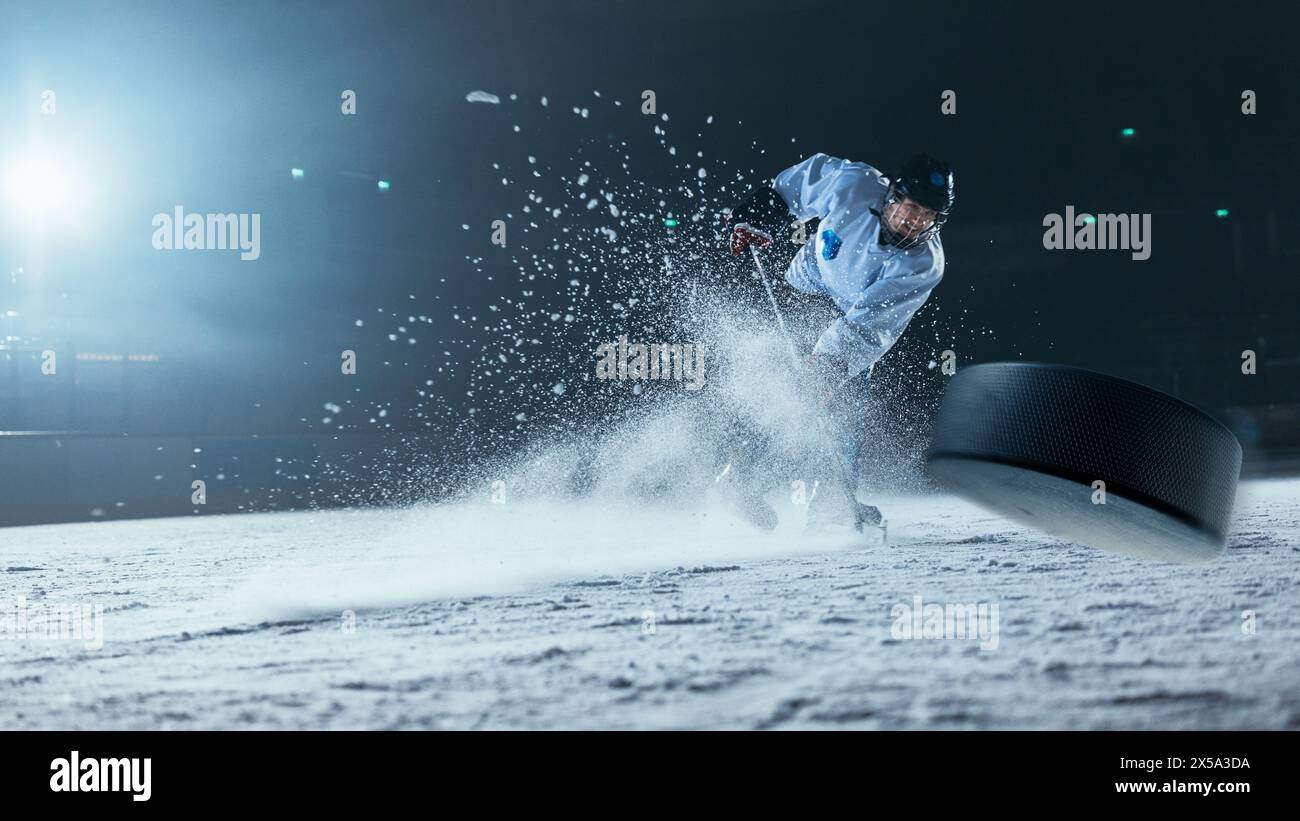 Ice Hockey Rink Arena: Professional Player Shooting the Puck with ...