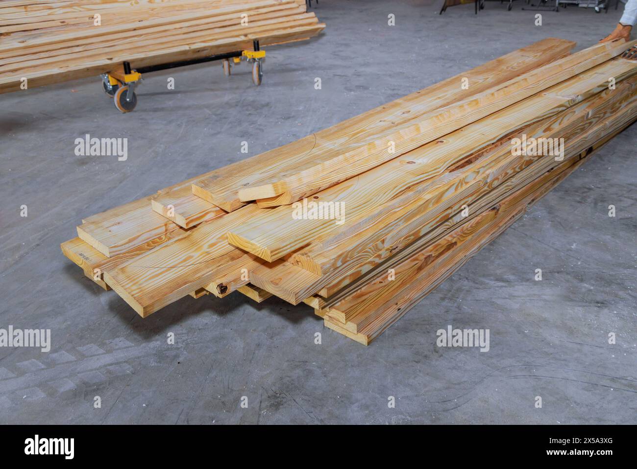 Wooden boards are stacked on construction site are ready to be used ...