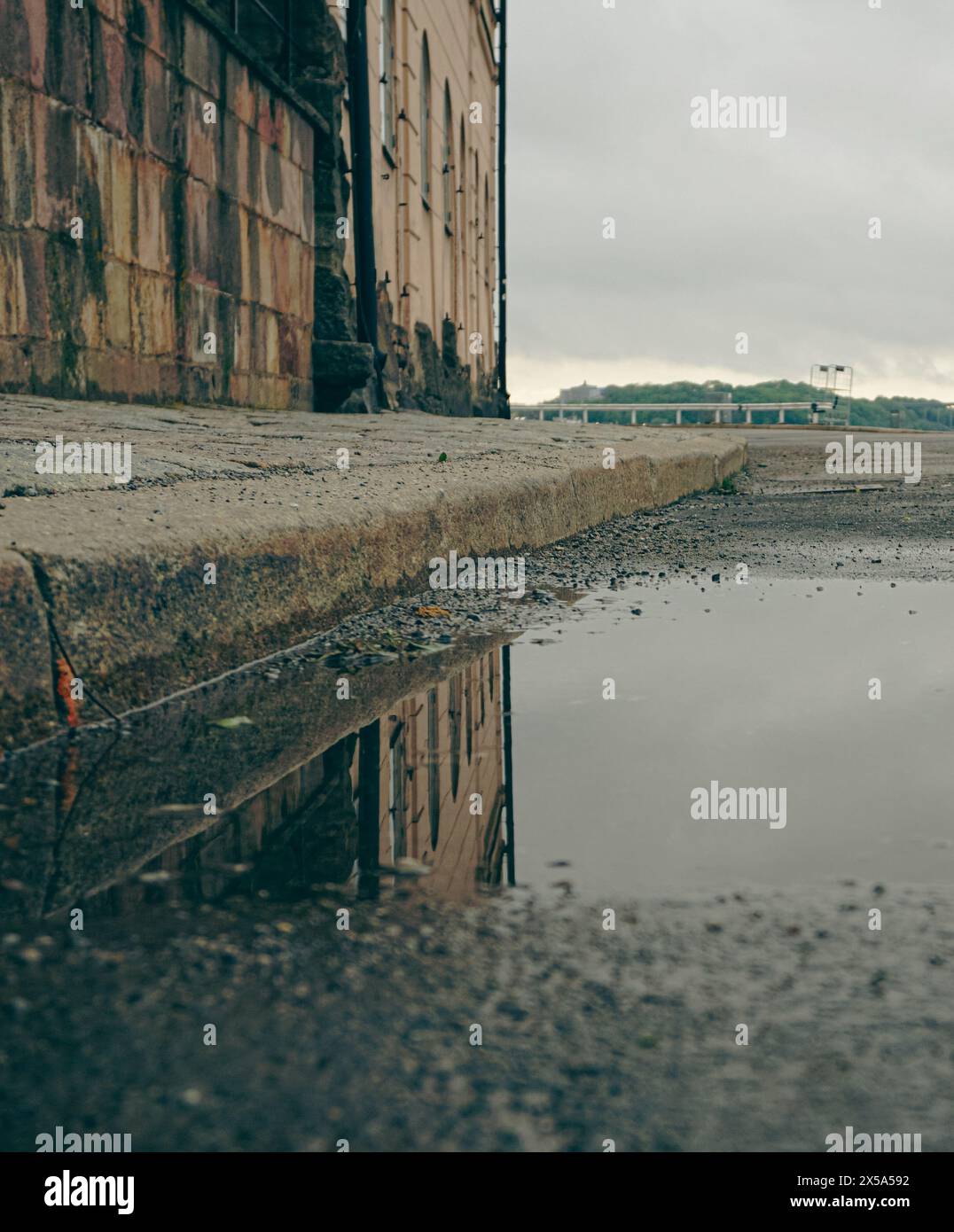 Puddle on alley street hi-res stock photography and images - Alamy