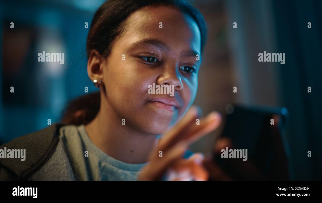 Portrait of a Teenage Multiethnic Black Girl Using a Smartphone. Young ...