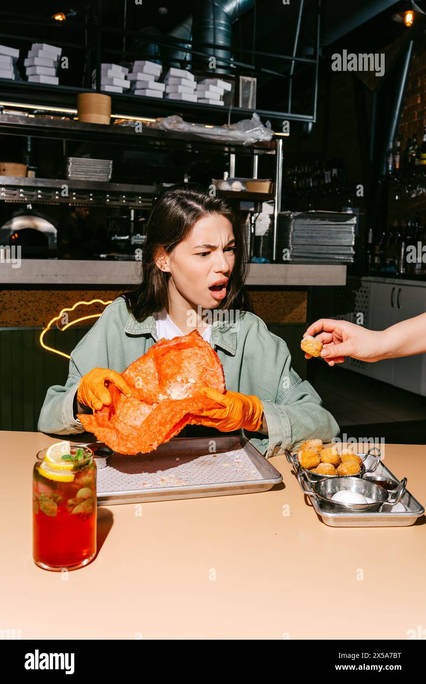 A baffled woman experiences a giant cheburek with a side of crunchy ...