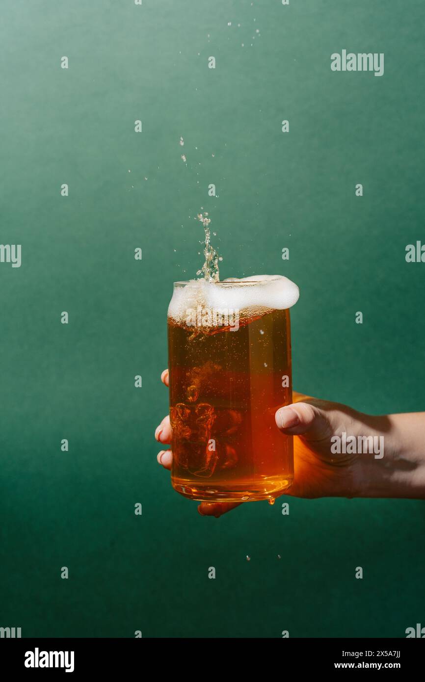 Woman holds refreshing glass beer hi-res stock photography and images ...