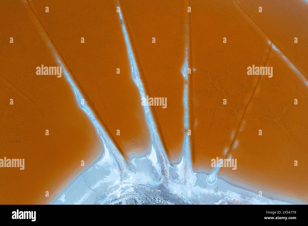 This aerial shot captures the abstract beauty of salt lagoons near ...