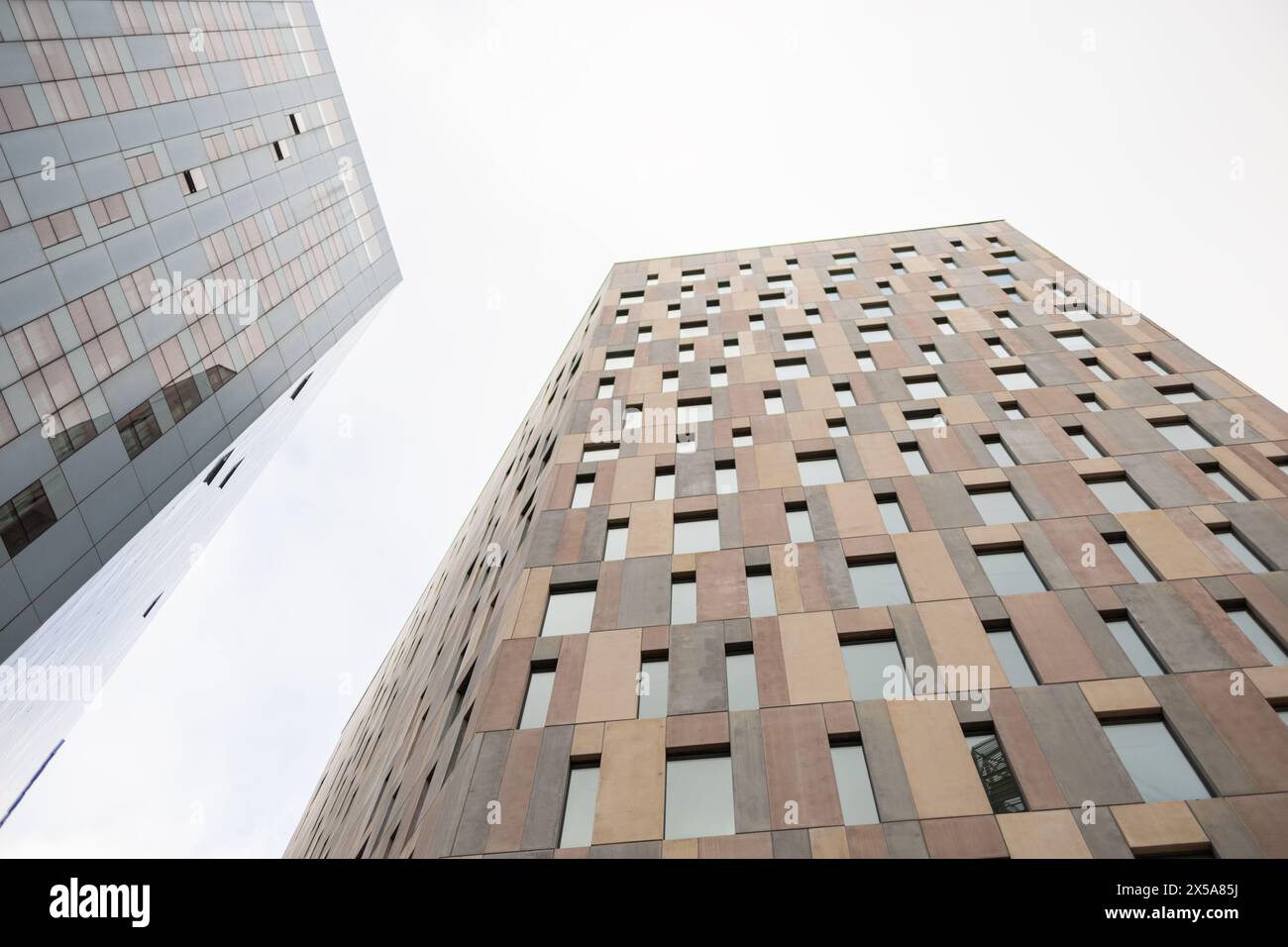 Upward view of modern high-rise buildings against a cloudy sky Stock ...