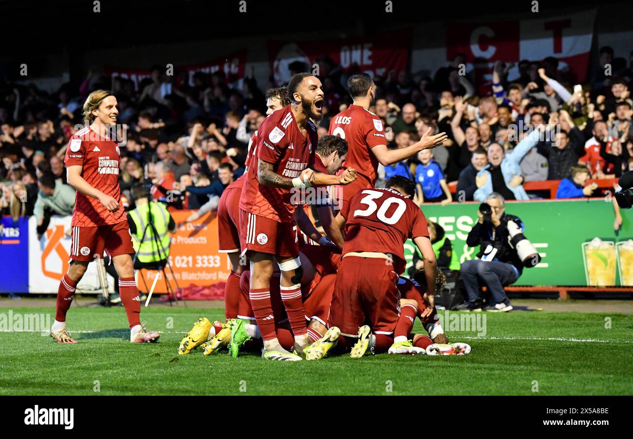 The Crawley players led by Jay Williams celebrate their third goal ...