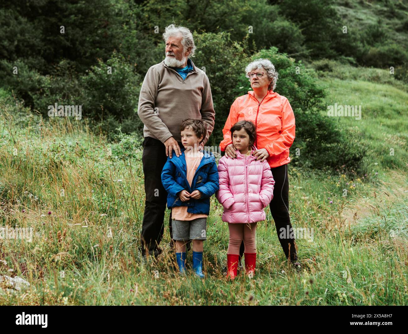 Grandparents and grandchildren enjoy nature together, reflecting family ...