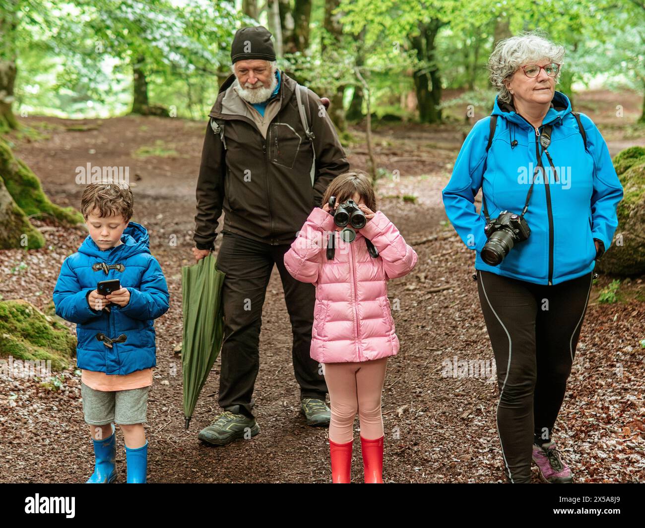 A family with grandparents and grandchildren spends quality time in the ...