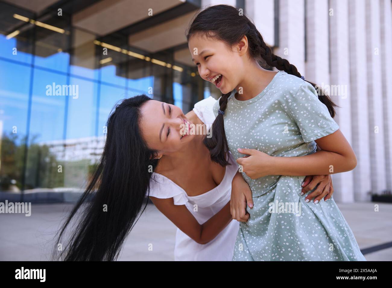 Embrace Between Mother and Daughter with autism spectrum Stock Photo ...