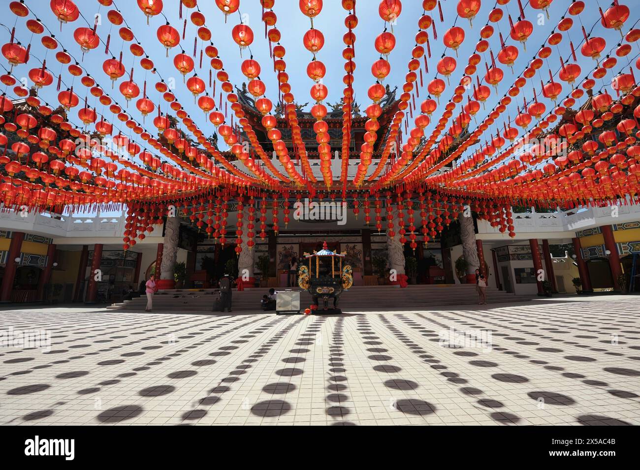 vibrant display of Chinese red lanterns at a temple festival. a large ...