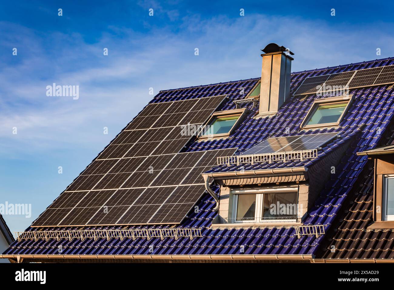 Photovoltaic panels on a roof of family house, solar system Stock Photo ...
