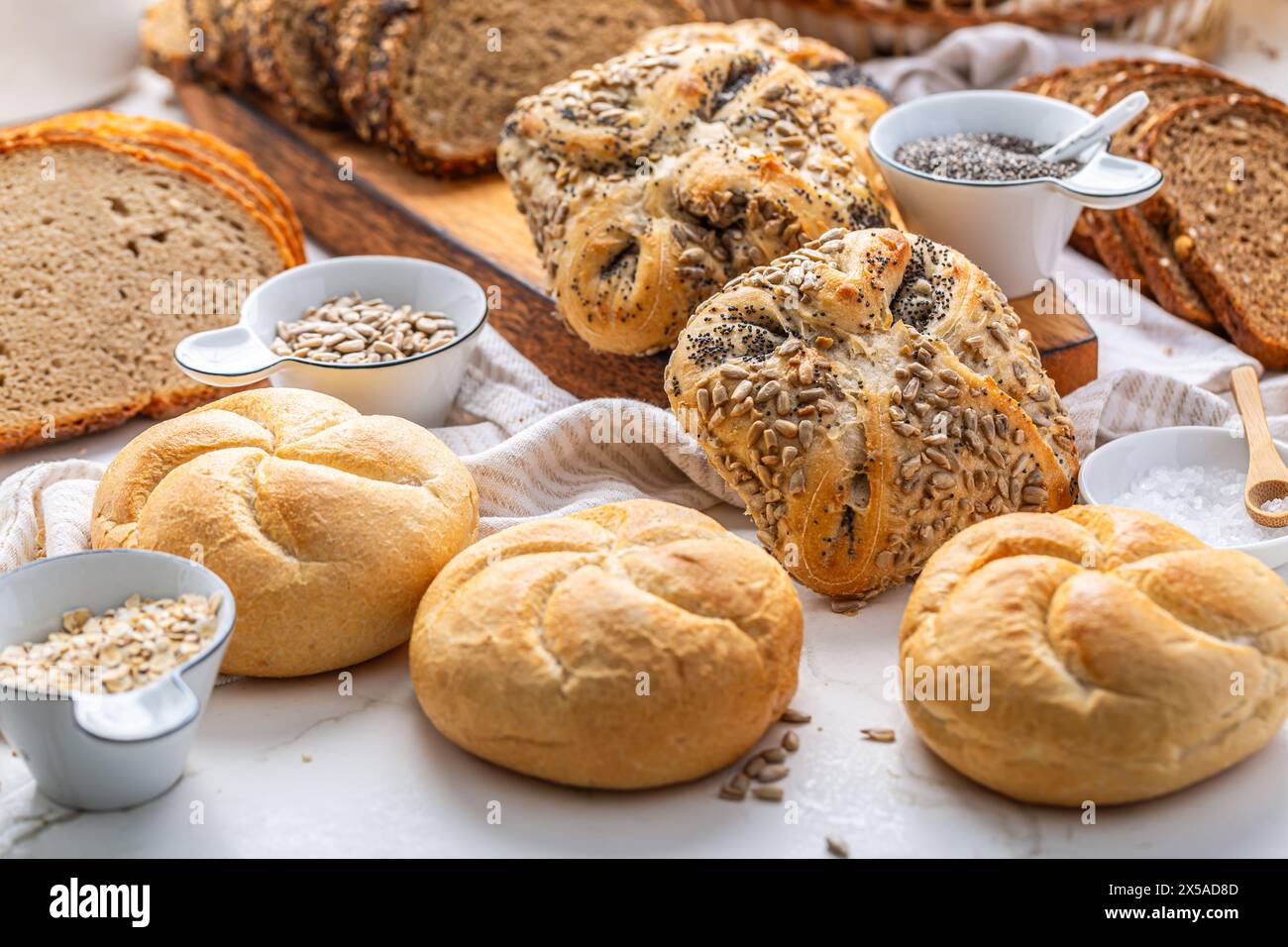 Assortment of bread, rolls and bakery products with salt and seeds ...