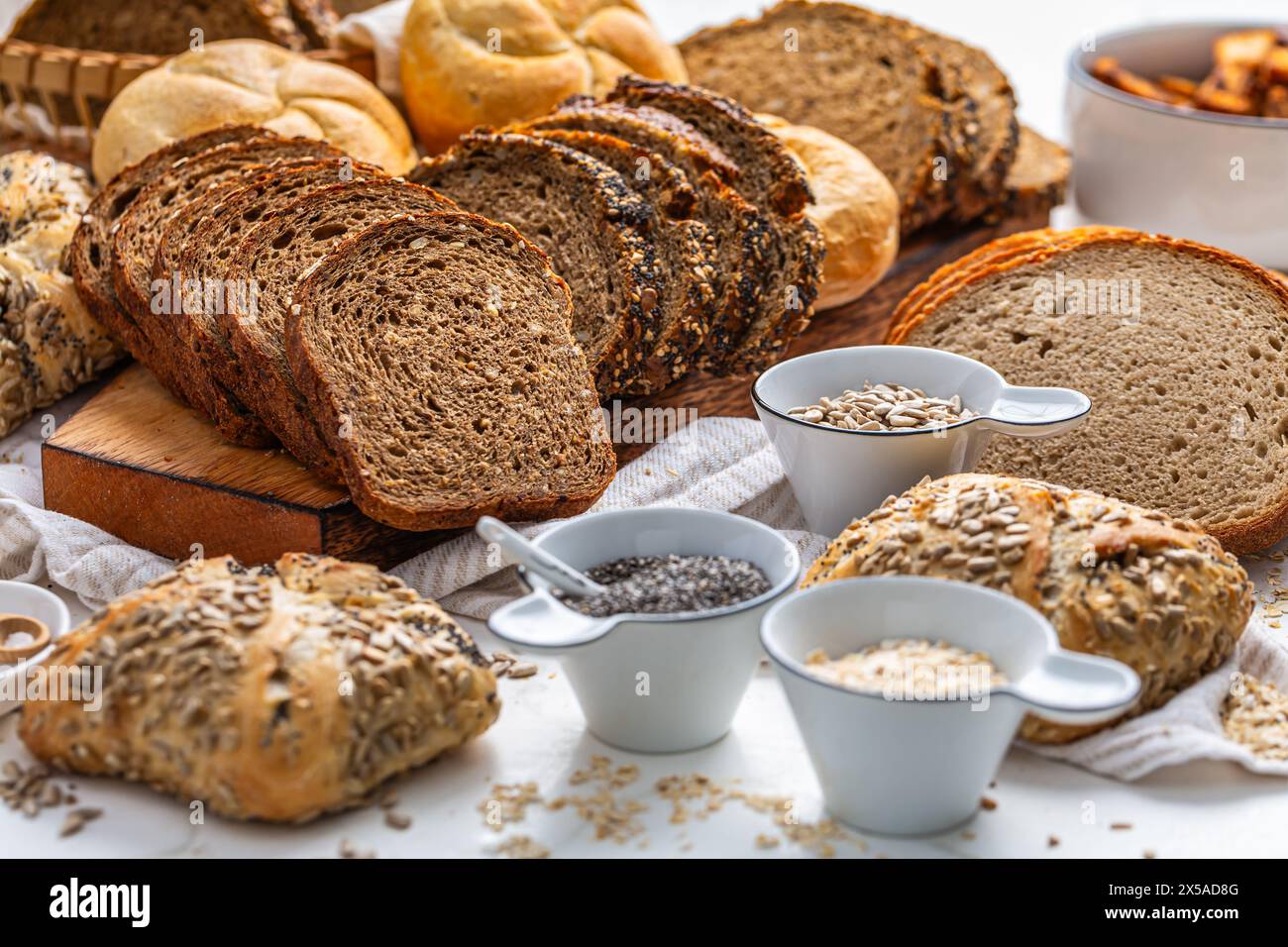 Assortment of bread, rolls and bakery products with salt and seeds ...