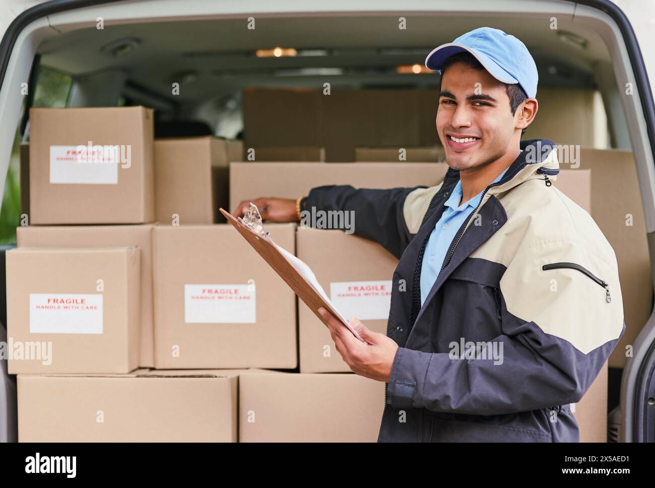 Man, portrait and delivery with van, clipboard and invoice or updates ...