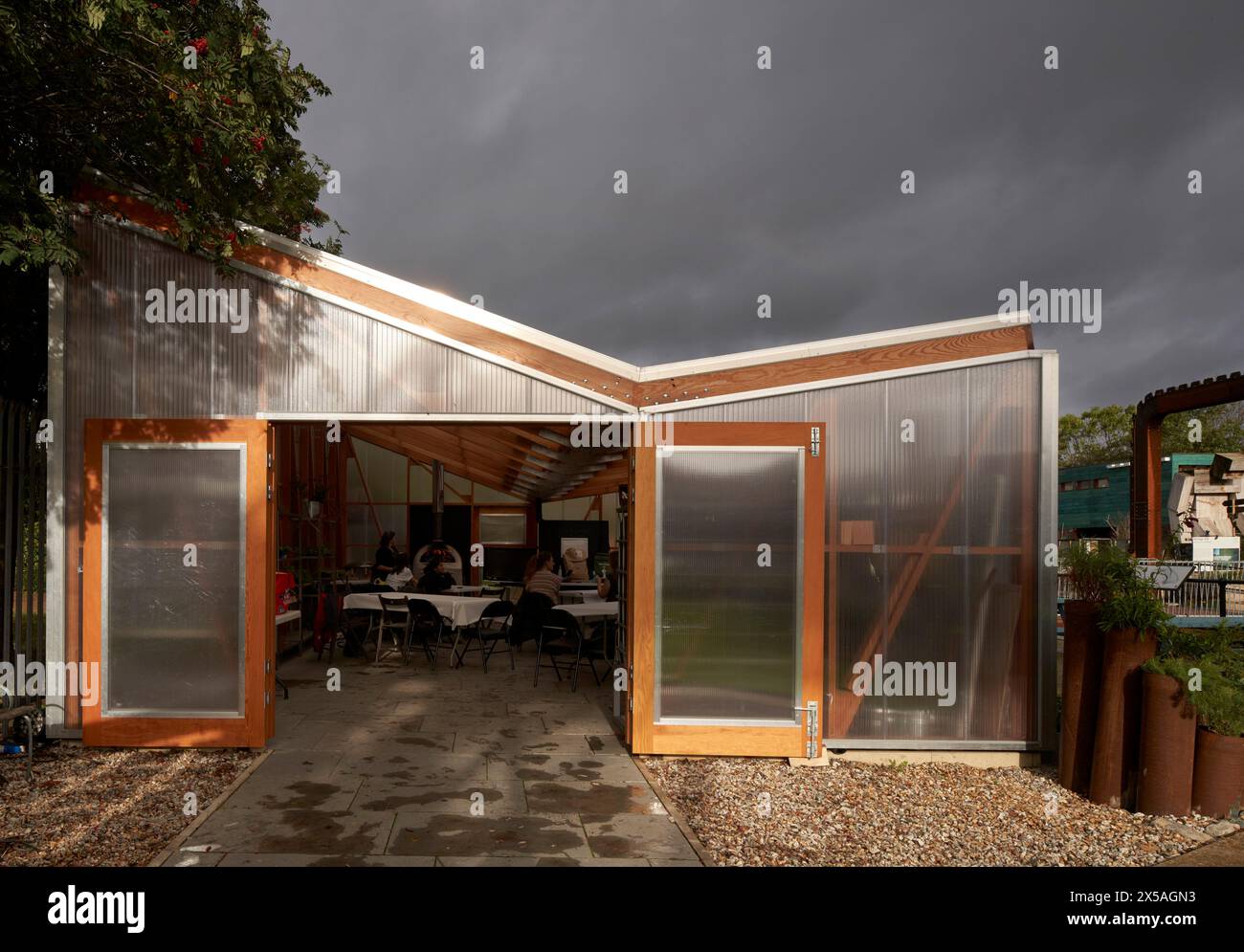 Front elevation of translucent entrance facade with door open. Cody ...