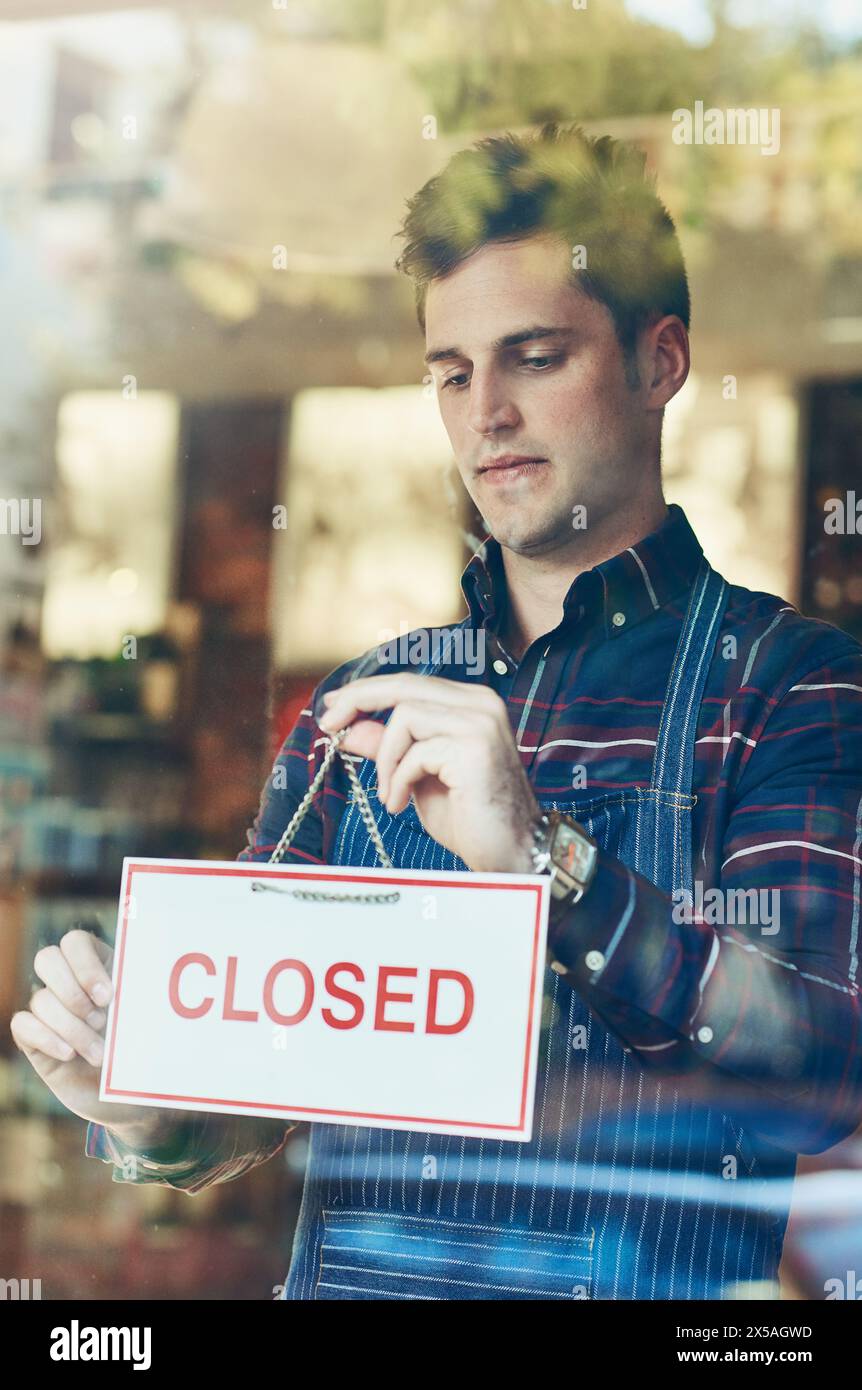 Closed, sign and waiter at door of store for restaurant, information ...