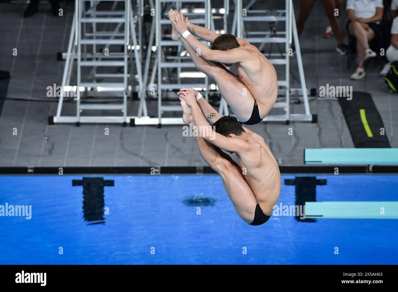 Tyler Downs and Greg Duncan compete during the International Diving ...