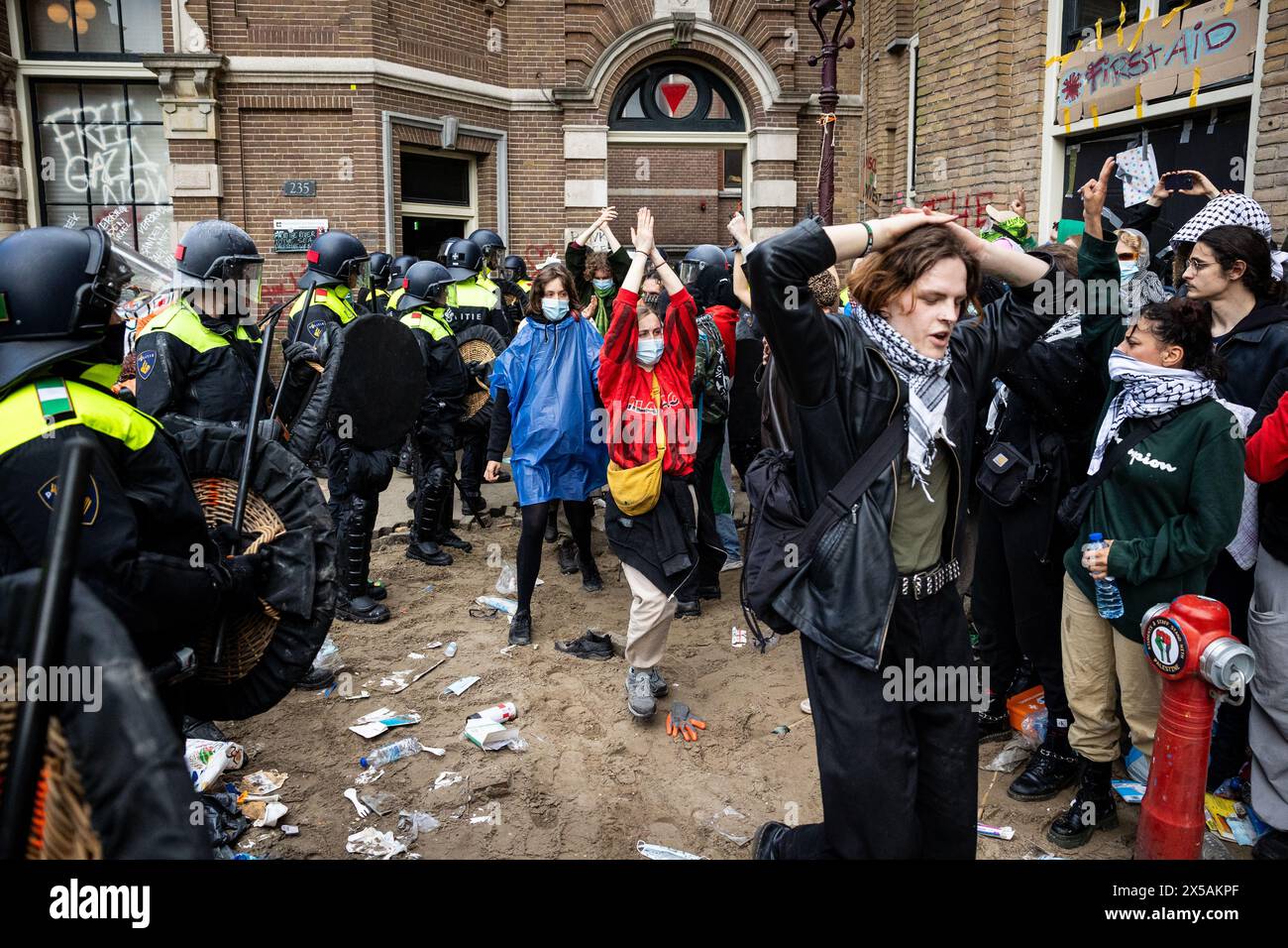 AMSTERDAM - Occupants inside the building are escorted outside the ...