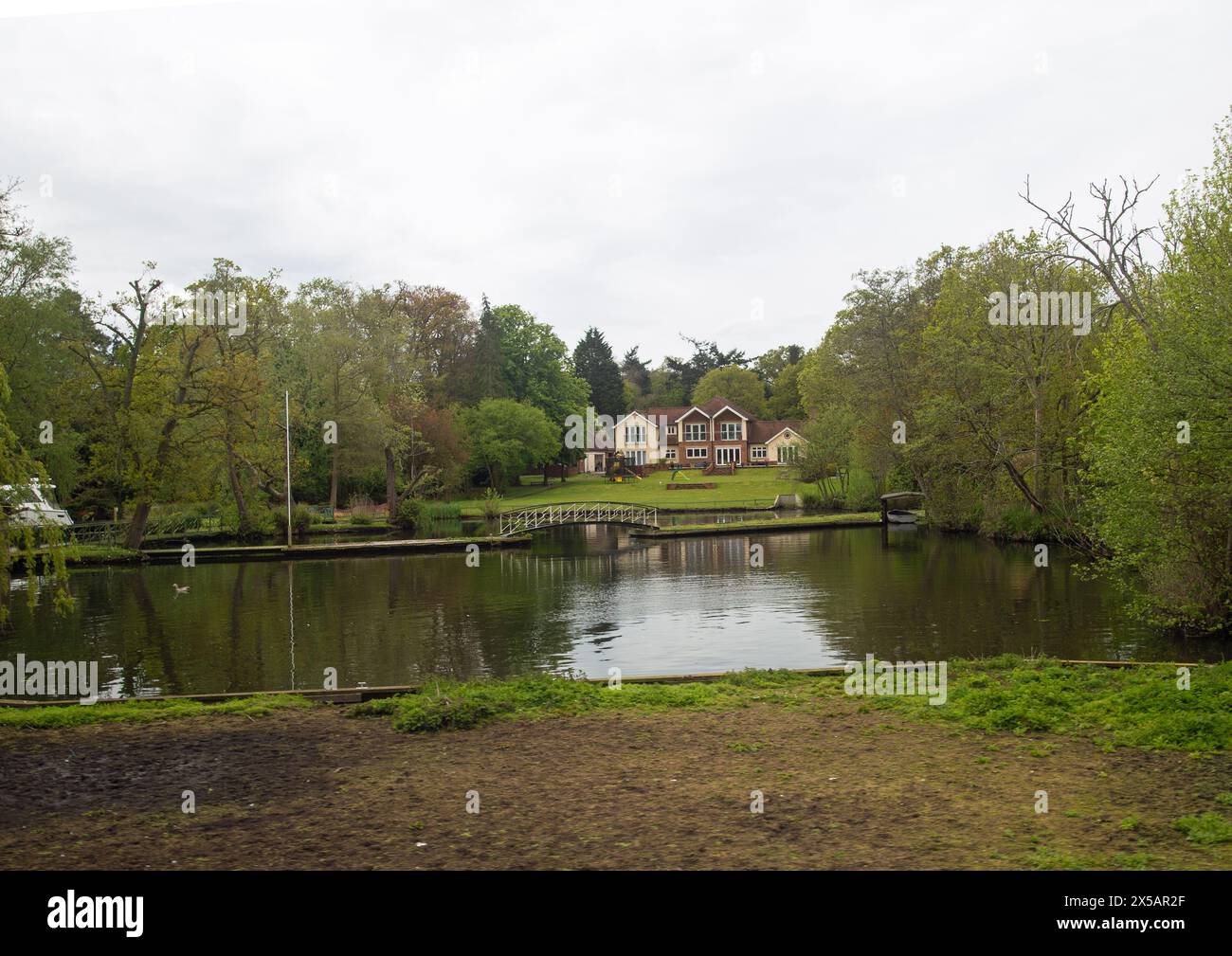 Wroxham, Norfolk, England, April, 2024, upmarket houses on the edge of ...