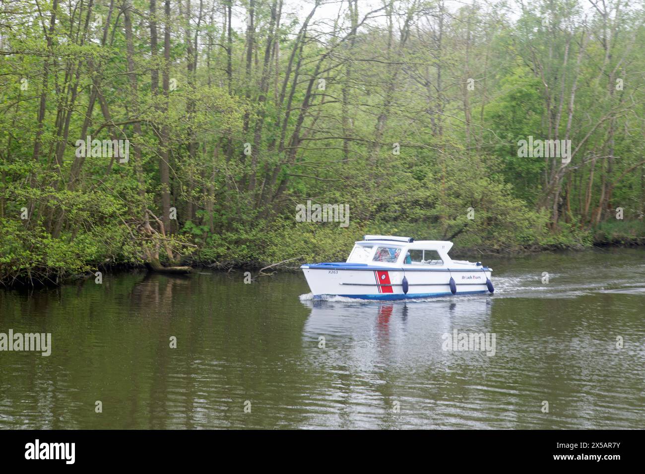 Wroxham, Norfolk, England, April, 2024 landscape format shot of a boat ...